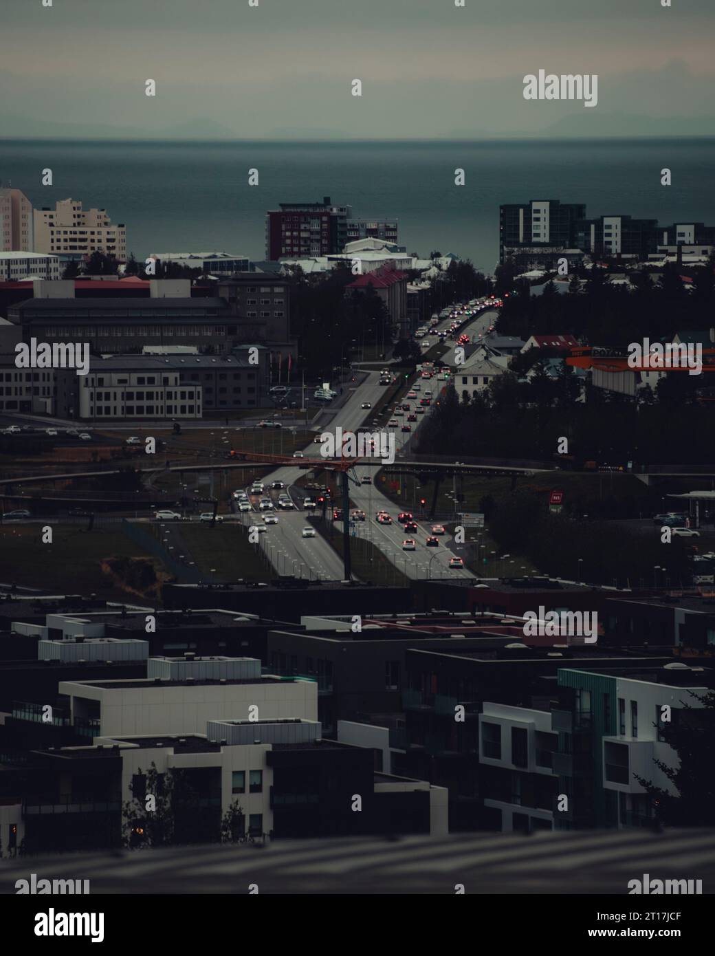 An aerial view of a bustling highway in a major city with vehicles ...