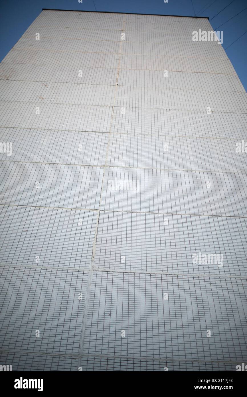 Wall of building. High wall without windows. White building ...
