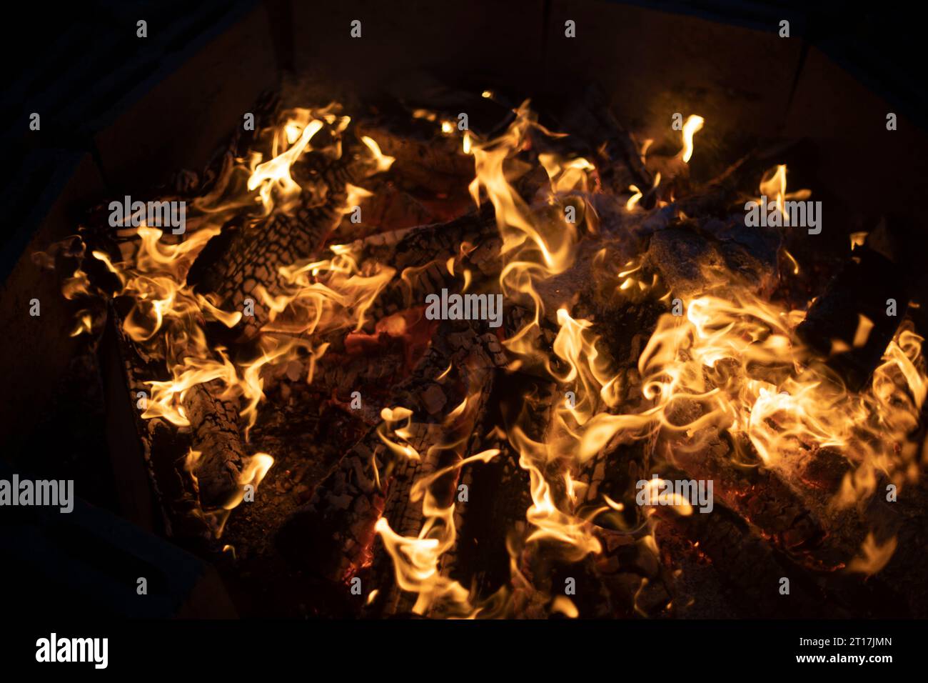 Flames of pyre. Yellow light. Firewood burning in fire. Flames Stock ...