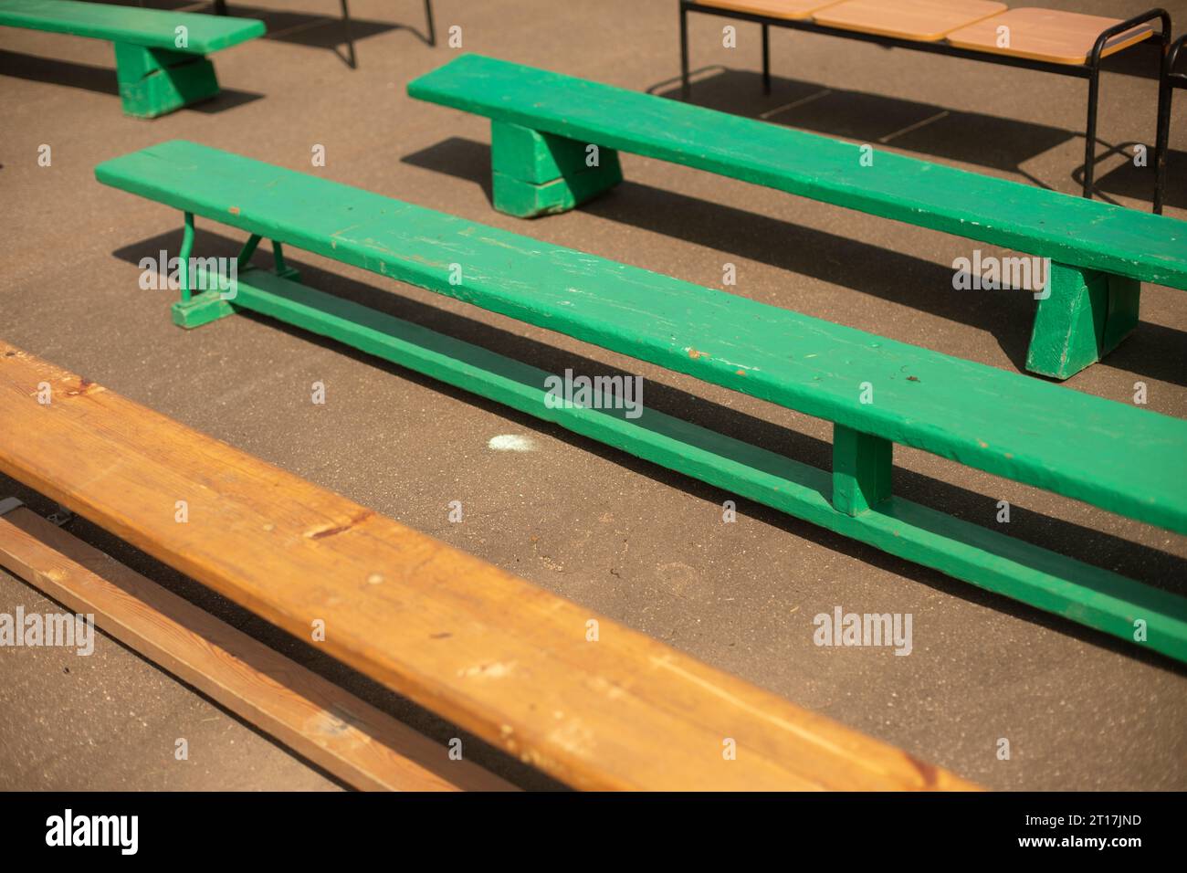 Empty seats. Places for guests. Benches stand in row on street ...