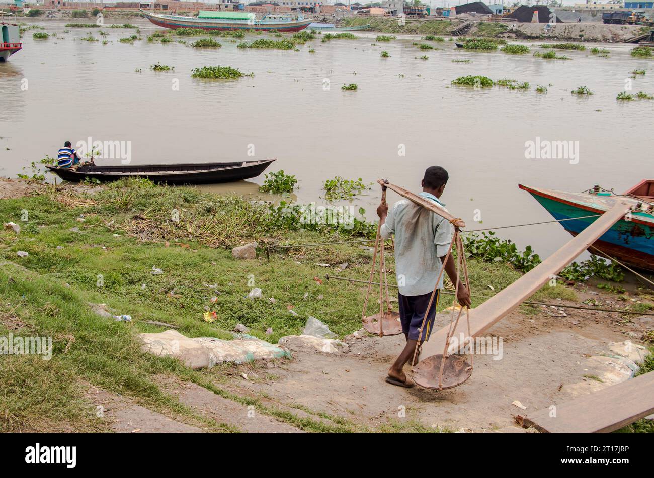 People offloading bricks from the boat, the image captured on May 29 ...
