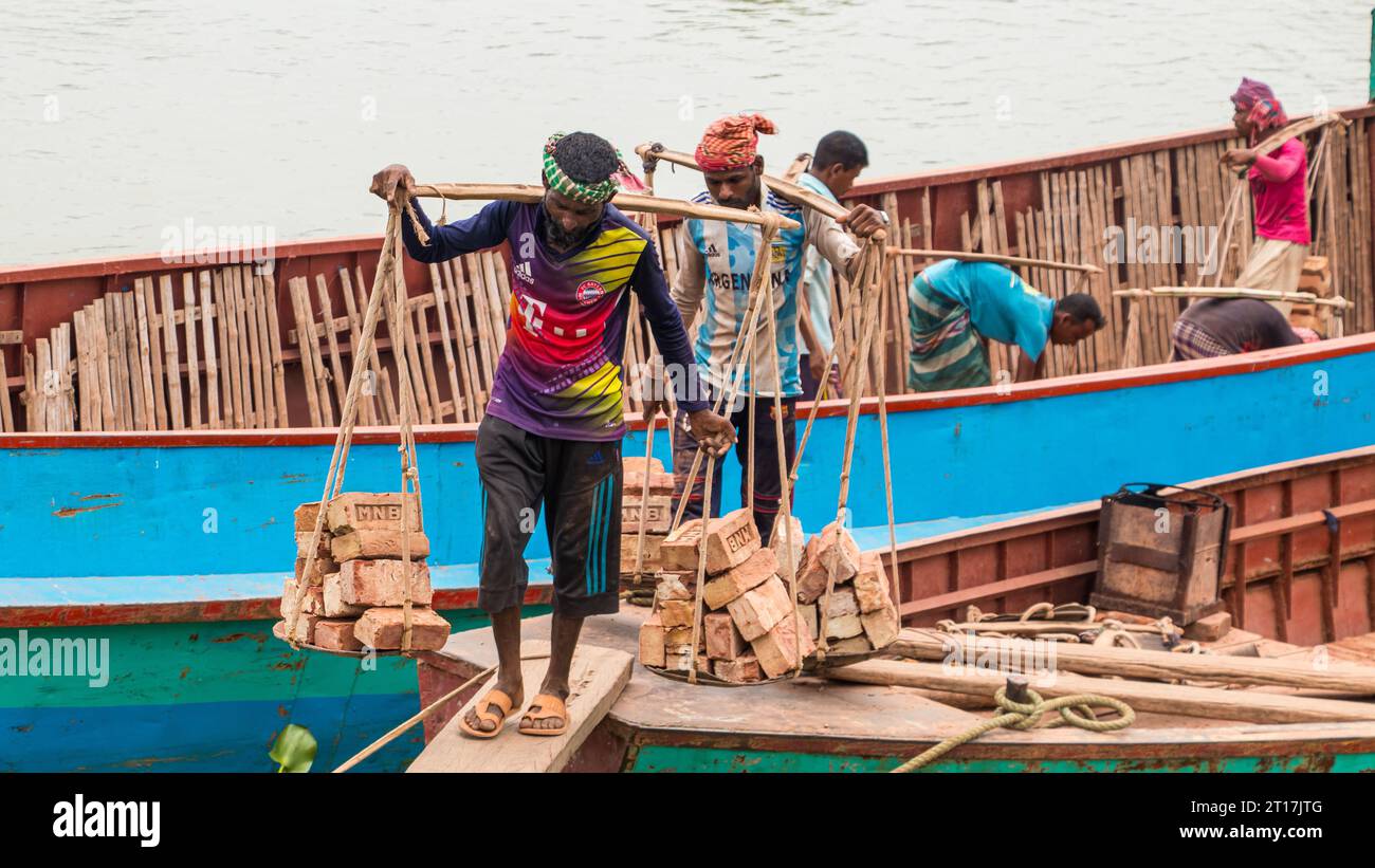 People offloading bricks from the boat, the image captured on May 29 ...