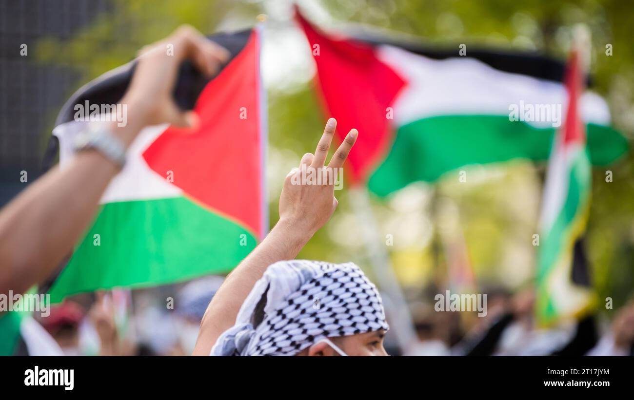 Berlin, Germany. 24th May, 2021. A man makes the Victory sign at a ...