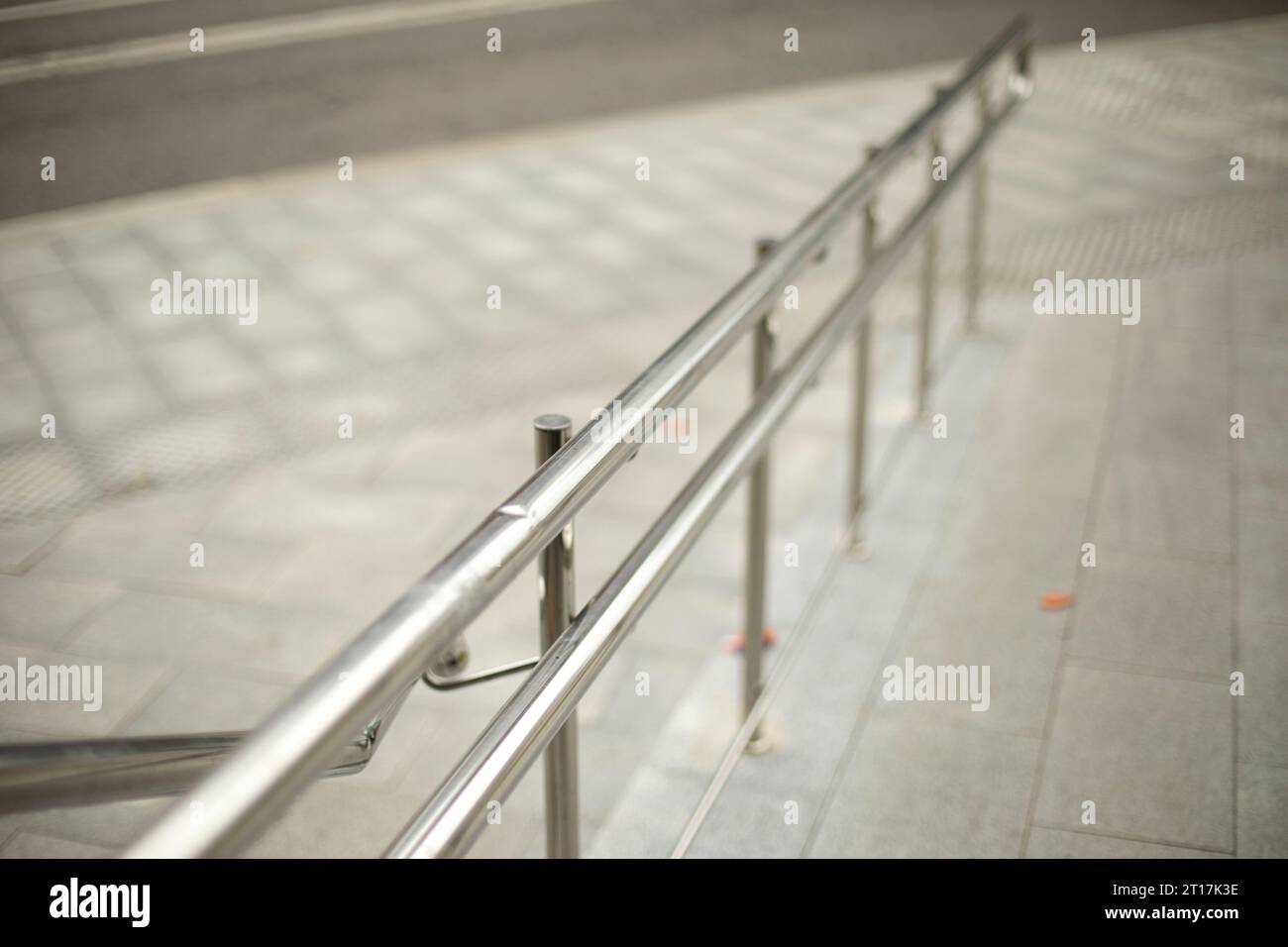 A handrail for a pedestrian. Steel handrail by the road. Pedestrian ...