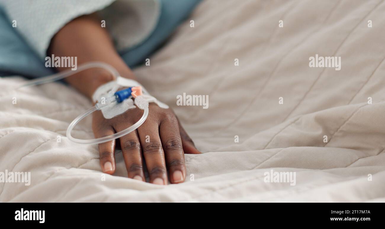 Person hand, bed and drip in closeup, clinic or treatment for hydration ...