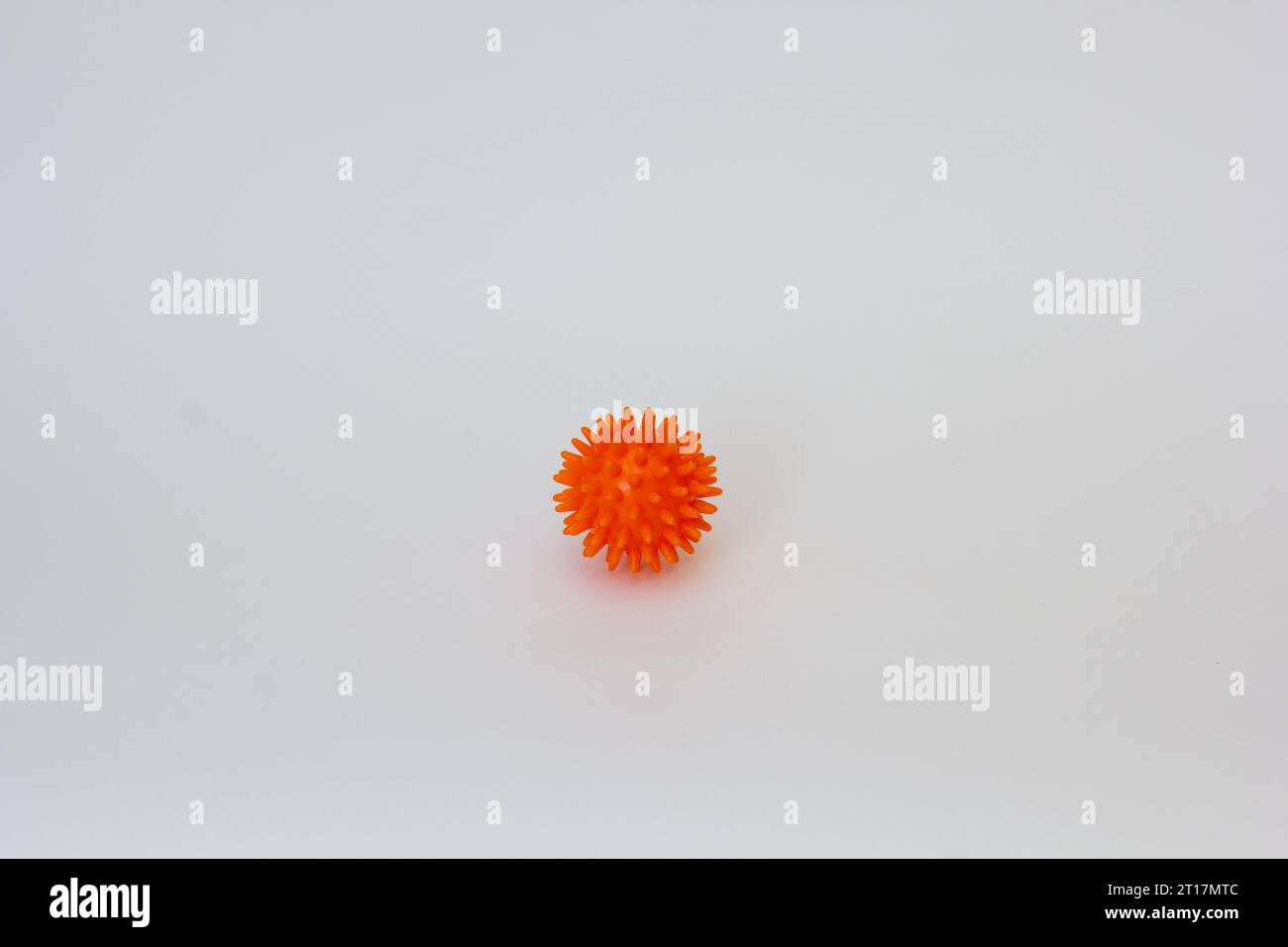 Orange spiky needle ball Stock Photo - Alamy