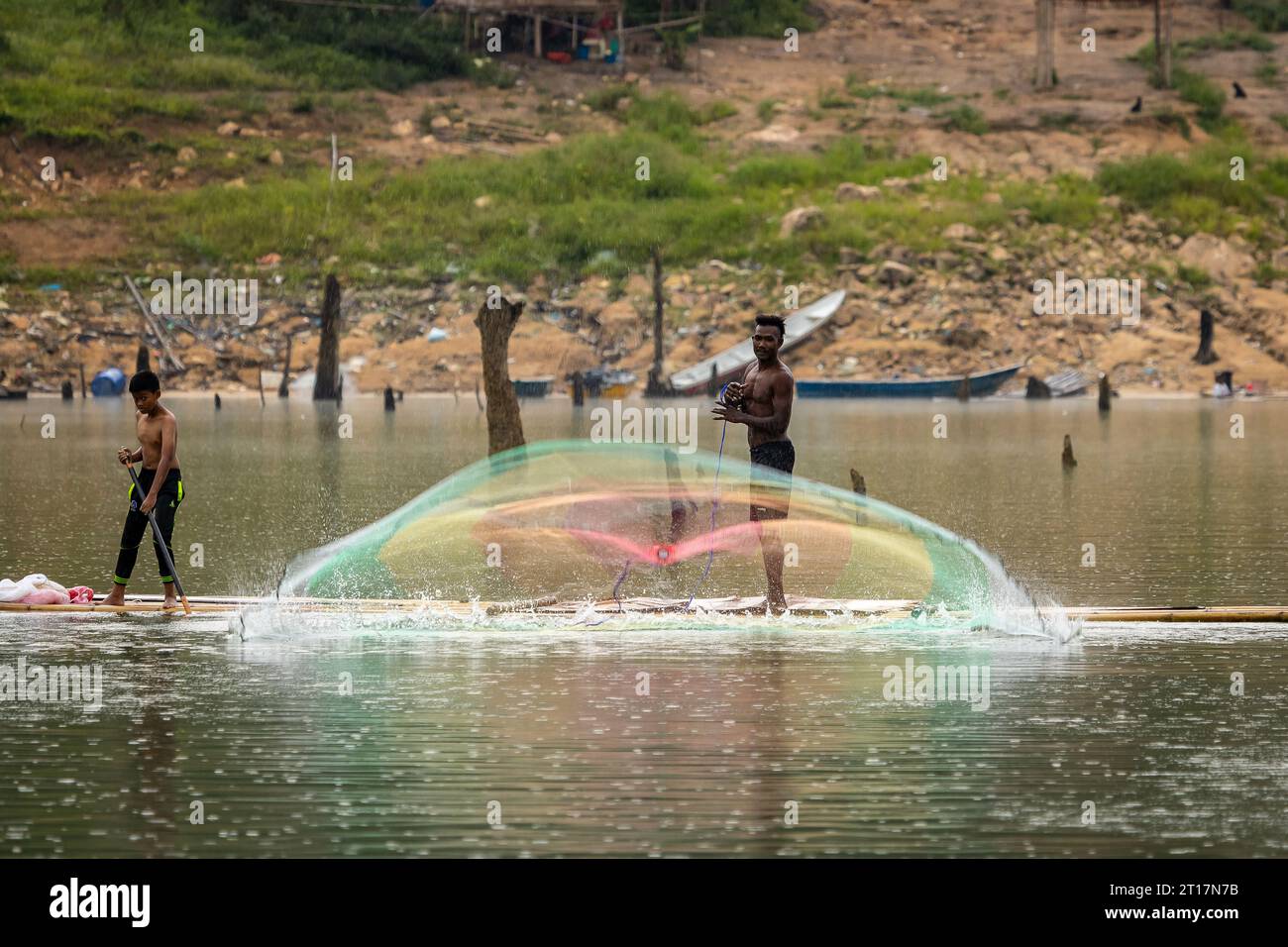 Indigenous people in Royal Belum Perak using net to catch fish Stock ...