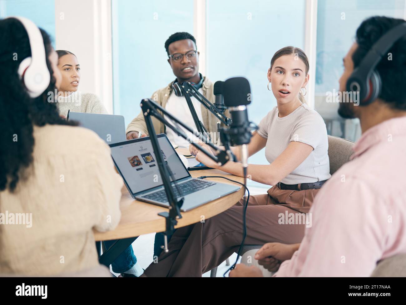 Conversation, podcast speaker and group of people, team or presenter ...