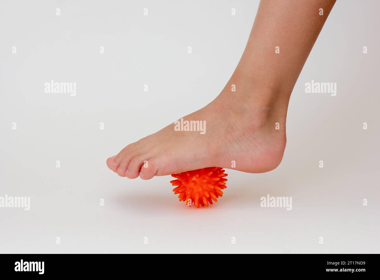 Cropped child leg doing exercises with spiky needle ball Stock Photo ...