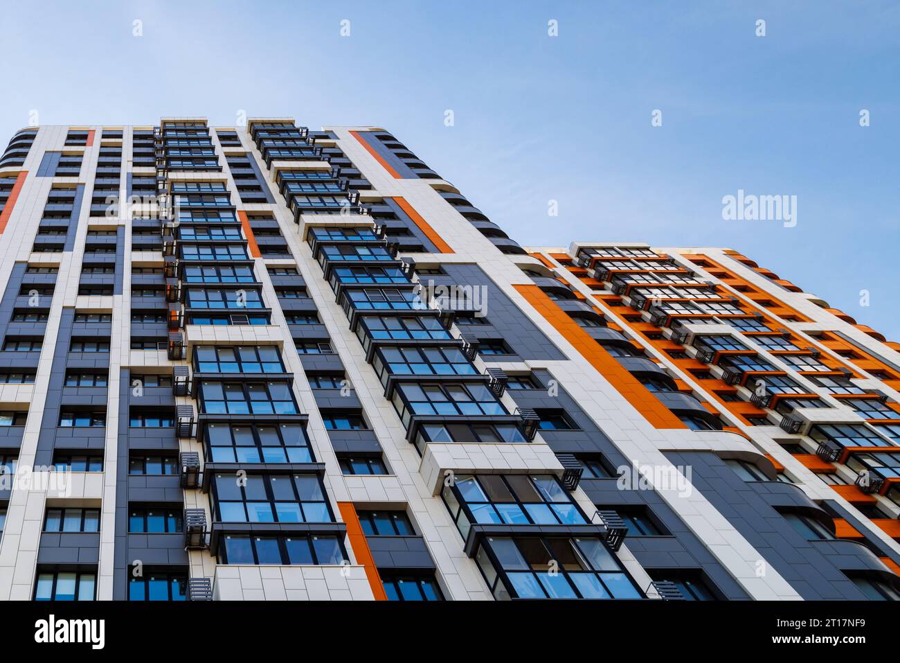 freshly built high rise apartment buildings on blue sky background at ...