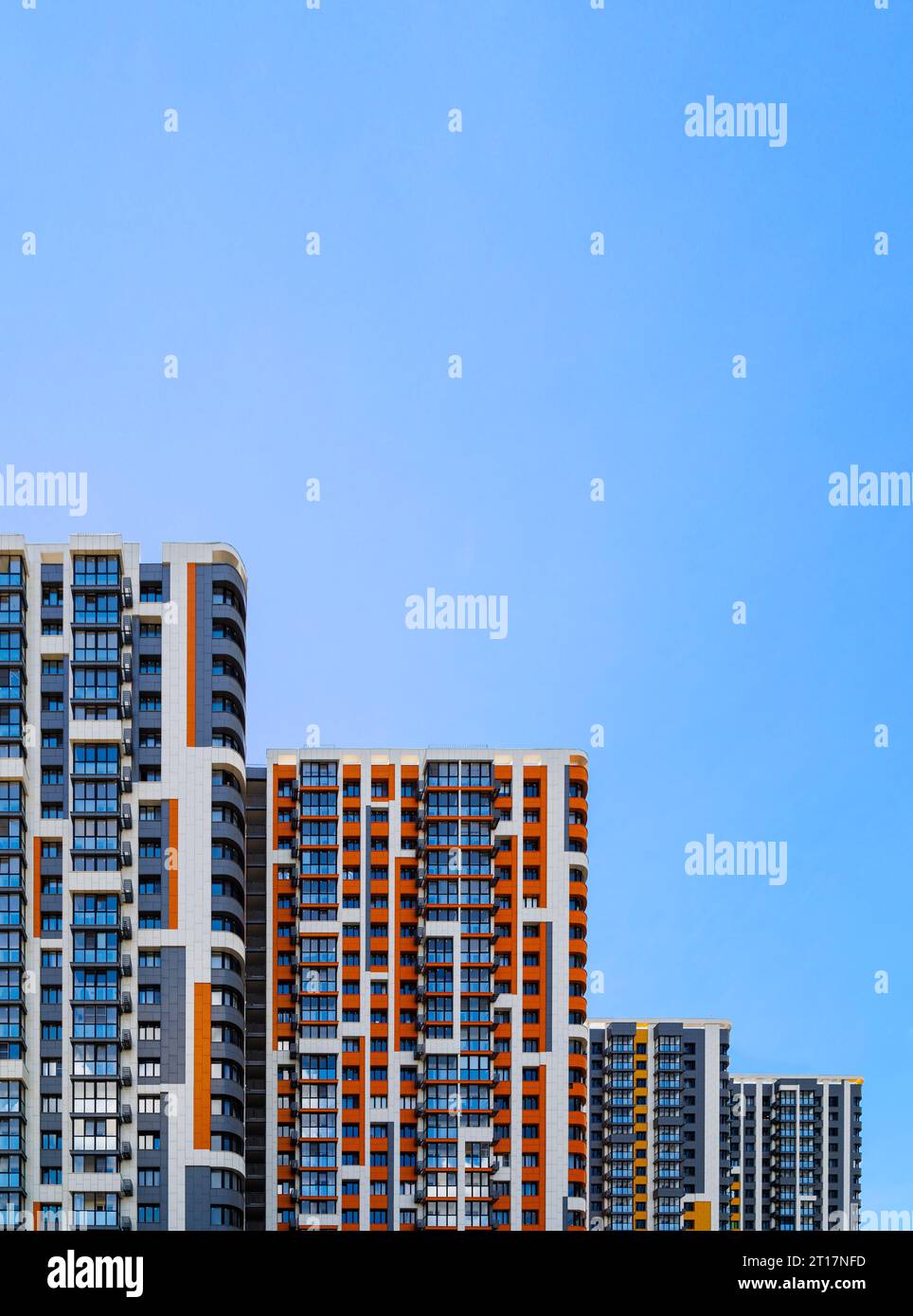 freshly built high rise apartment buildings on blue sky background ...