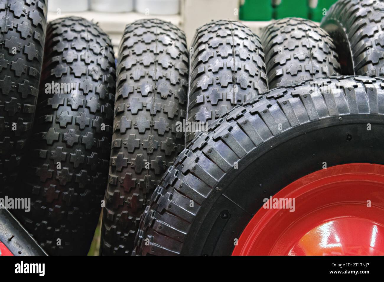 black rubber barrow wheels with grippy tread surface Stock Photo - Alamy