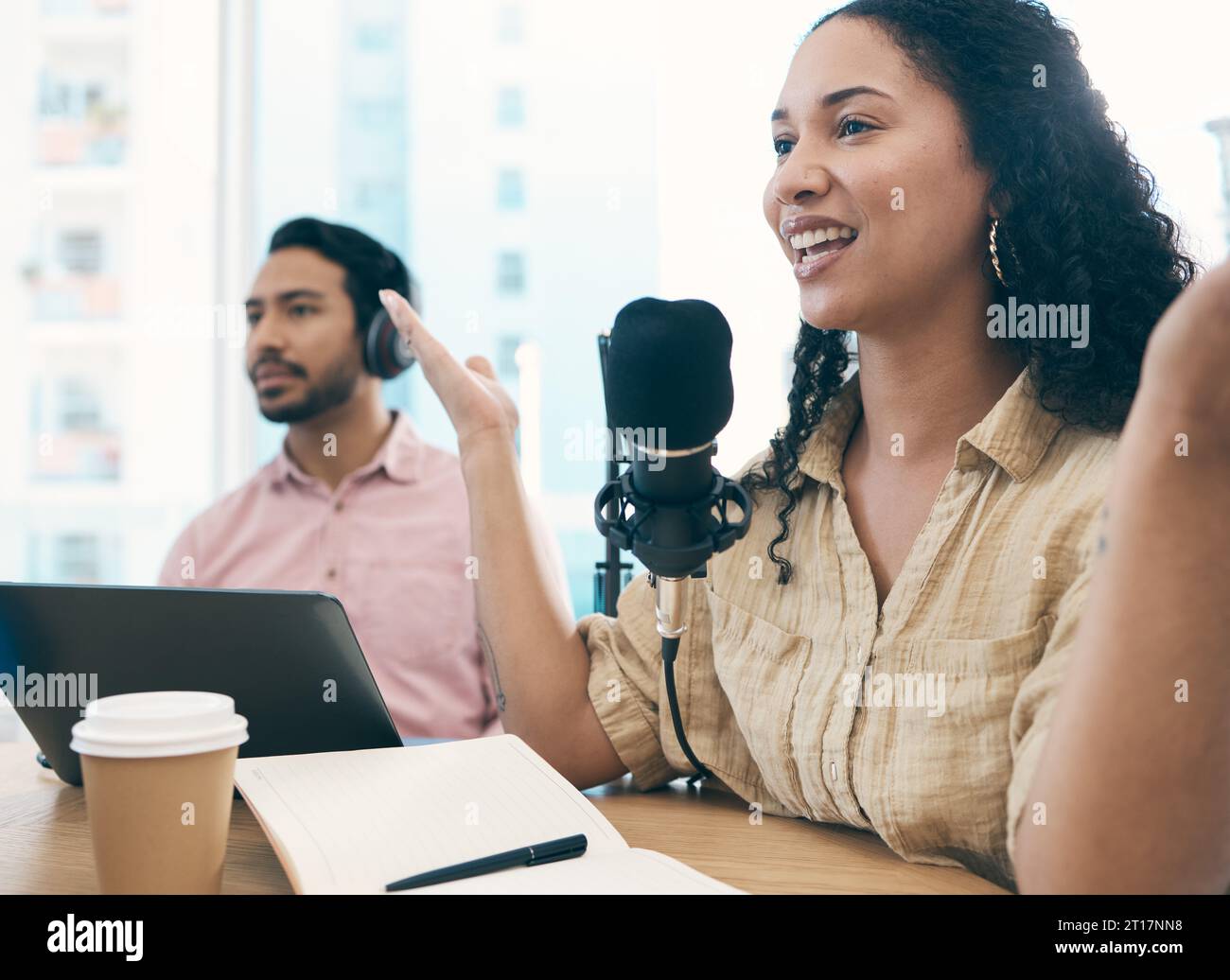 Man, woman and radio with interview, live streaming and talk show with ...