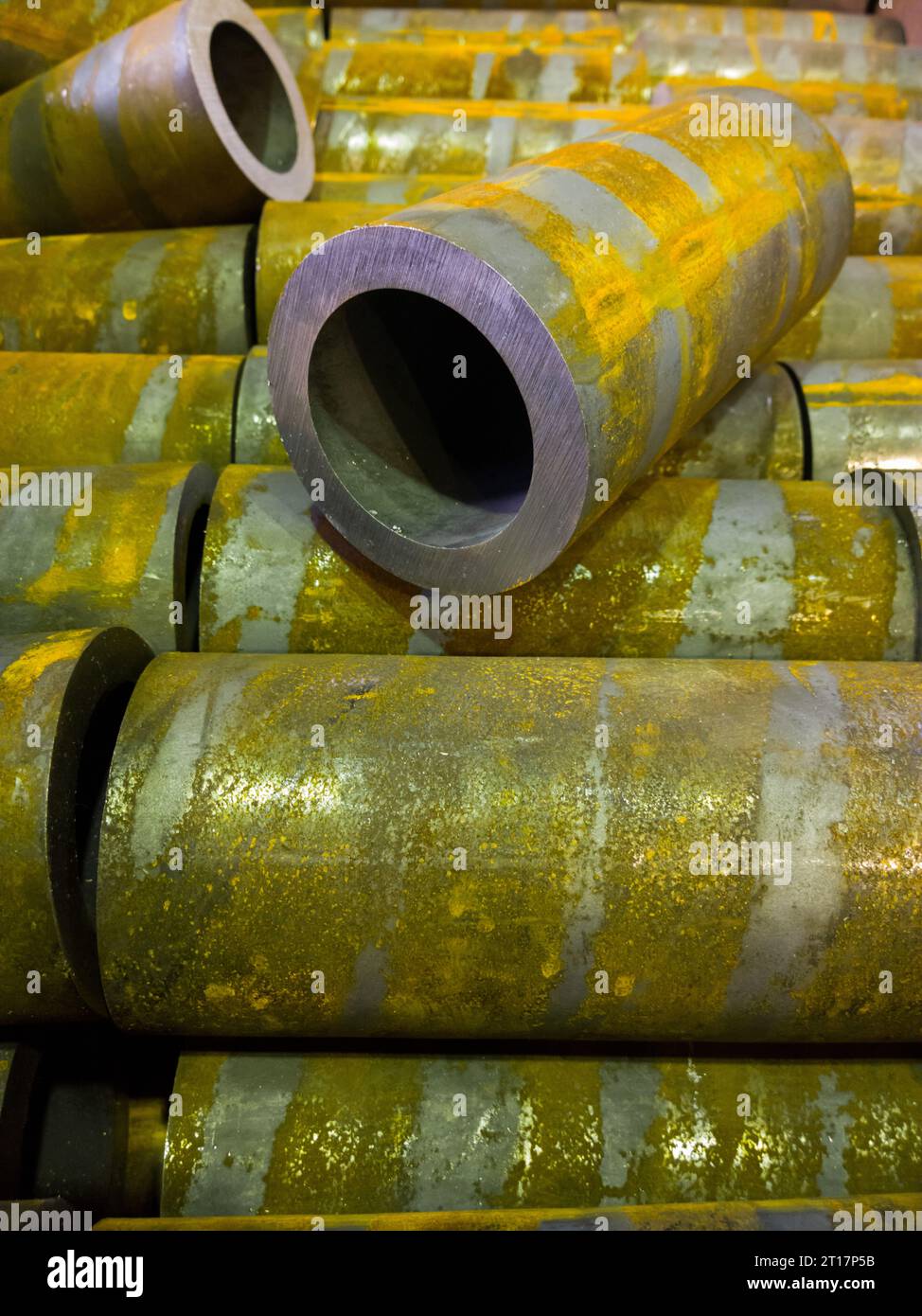 rusted thick steel pipe chunks after sawing waiting for machining ...