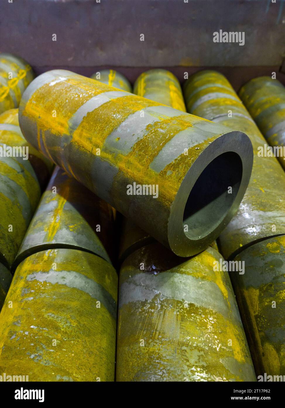 rusted thick steel pipe chunks after sawing waiting for machining ...