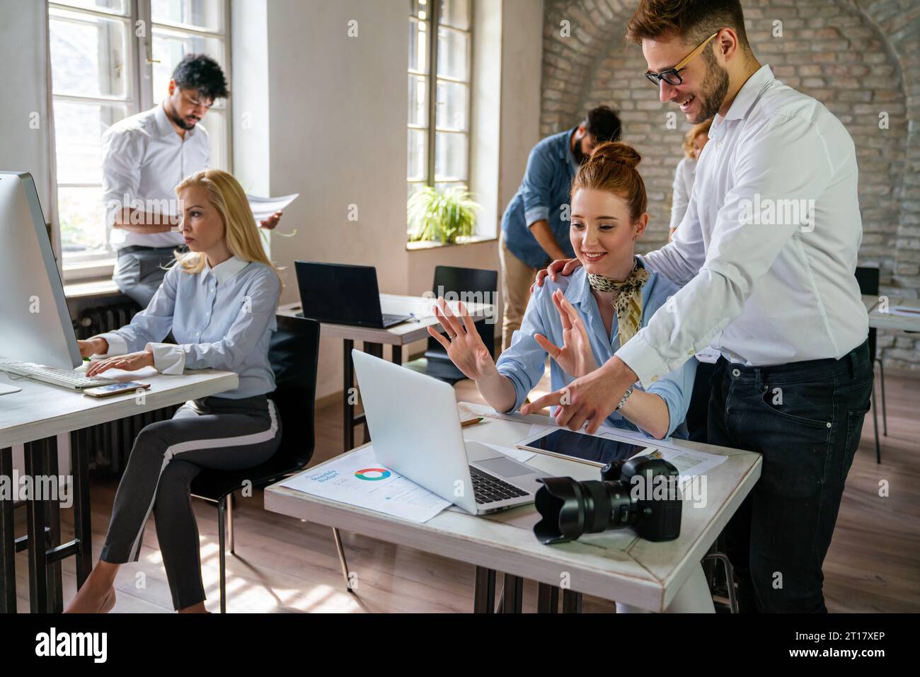Portrait of creative designer team smiling while working together in ...