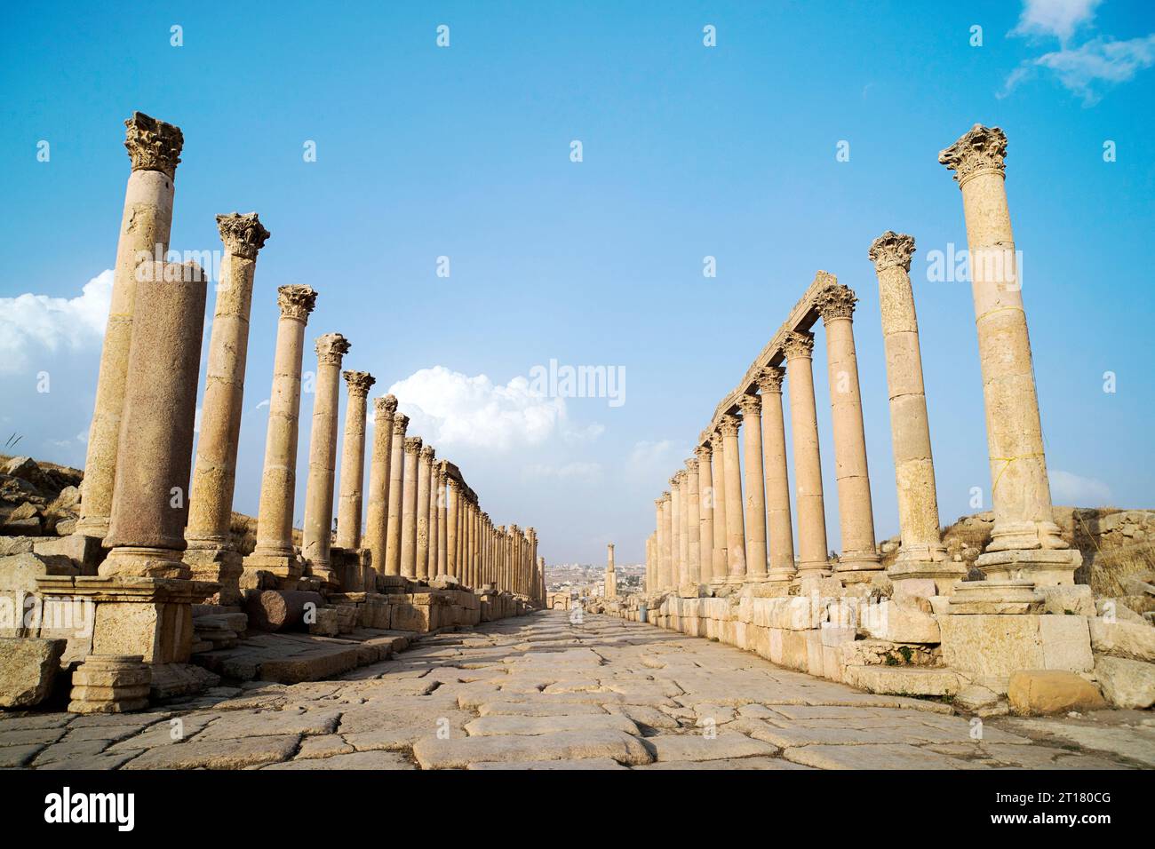 A view looking down the Cardo showing stone carved columns and paved ...