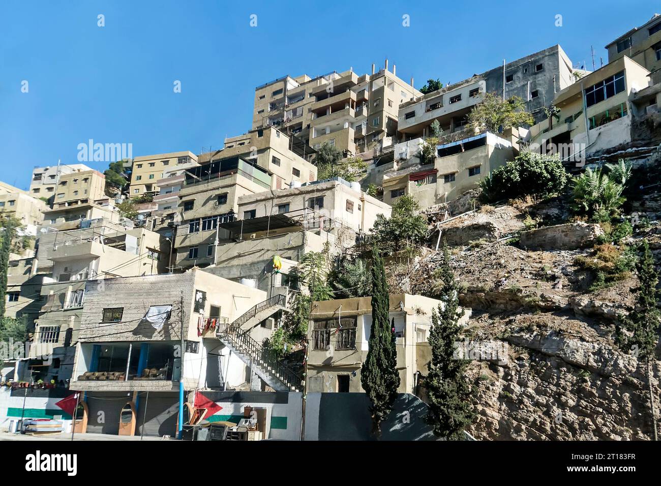 A view of the densely constructed homes at a hill in a typical Arab ...