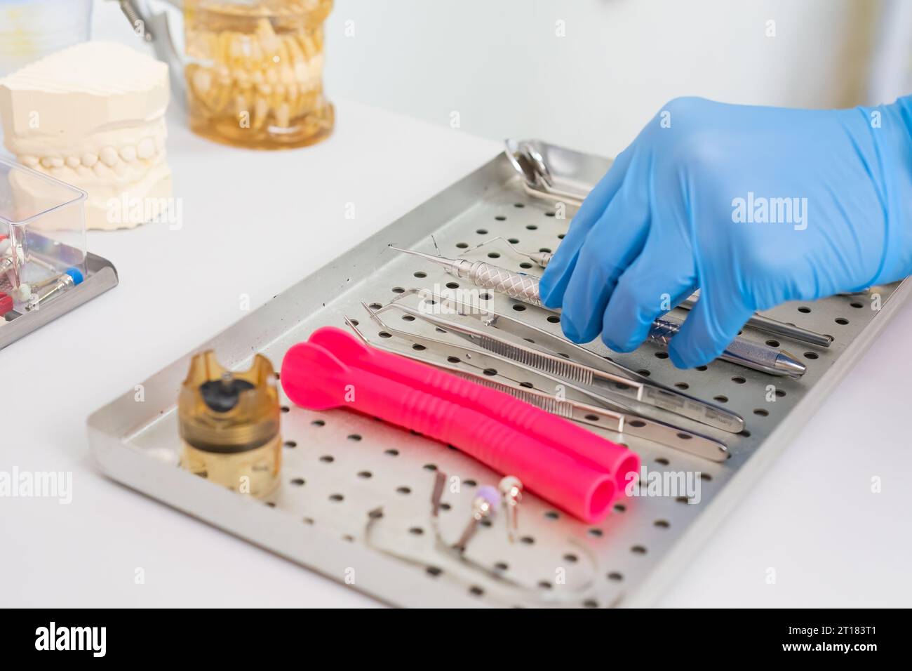 Dentist takes instrument for teeth treatment from the box Stock Photo ...