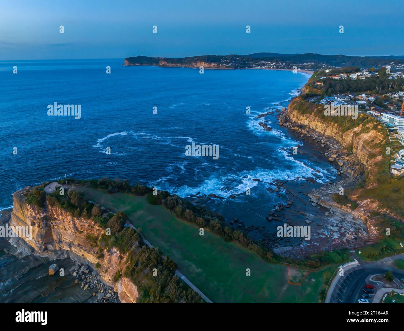 Aerial sunrise seascape from the rocky inlet known as The Skillion in Terrigal, NSW, Australia ...