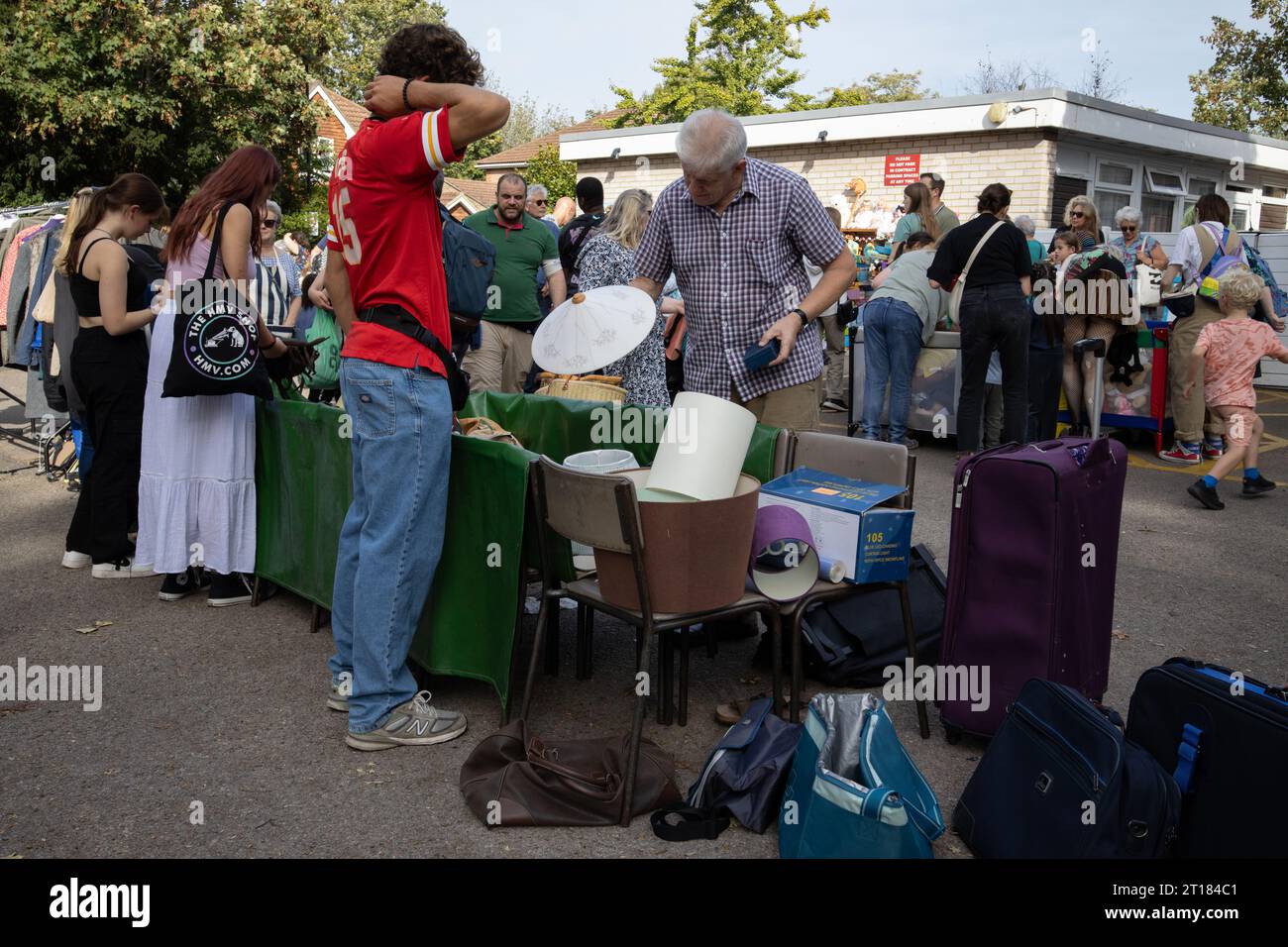 People attend a local community jumble sale in Southwest London ...