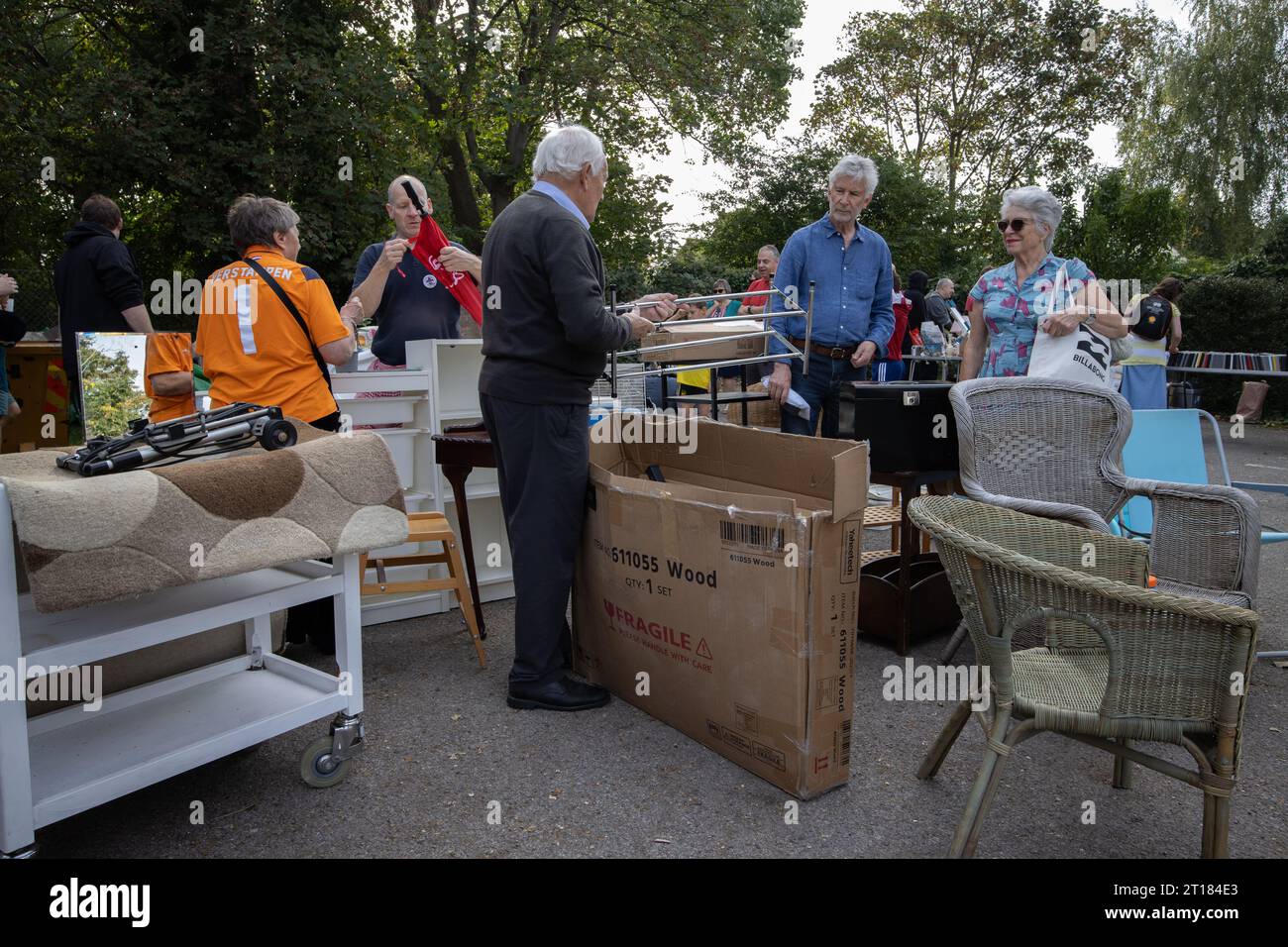 People attend a local community jumble sale in Southwest London ...