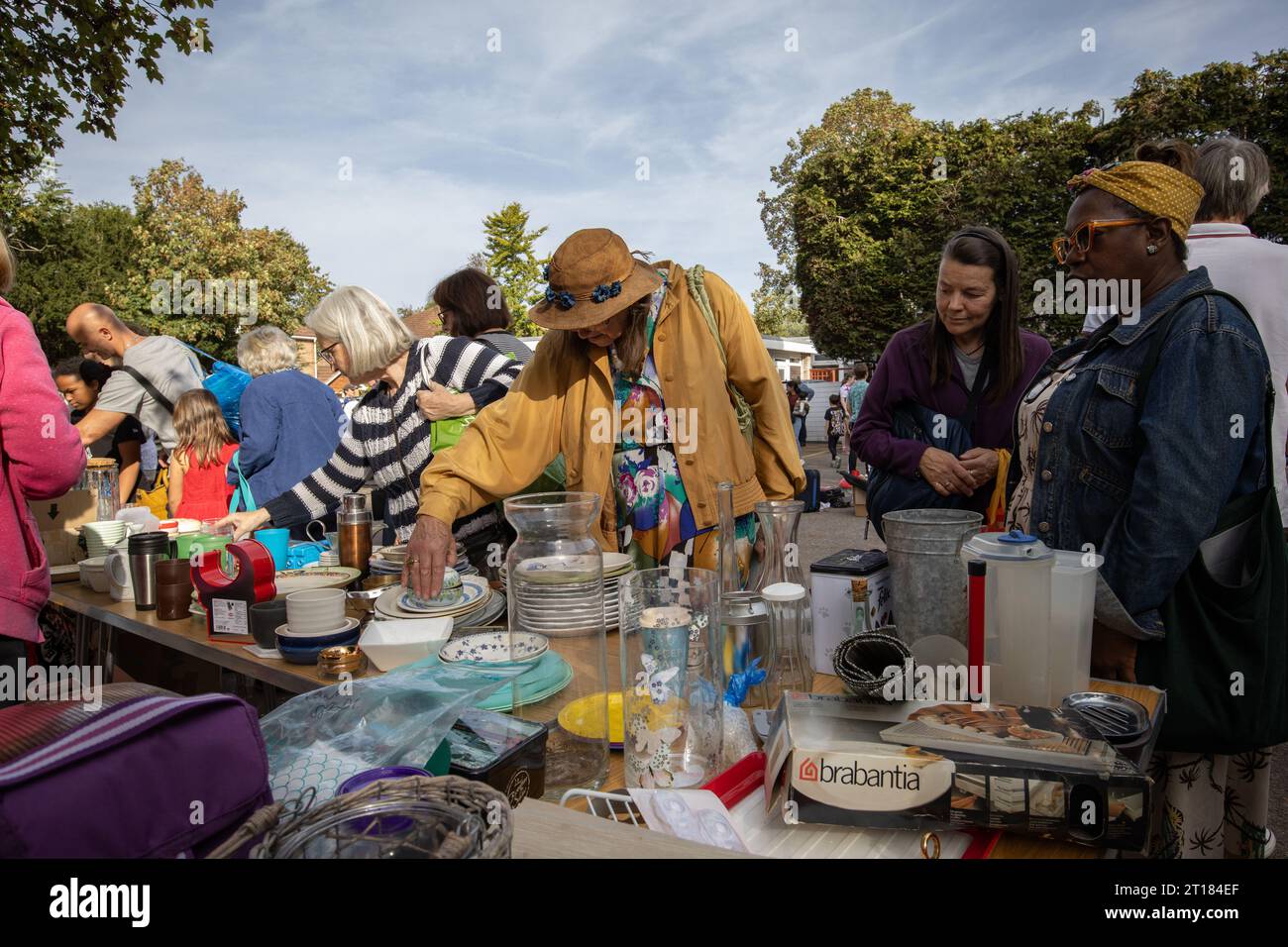 People attend a local community jumble sale in Southwest London ...