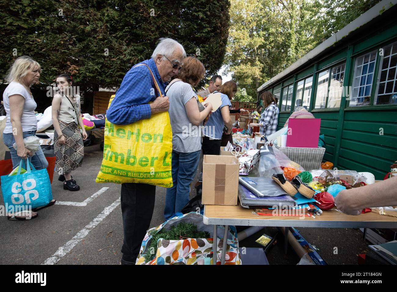 People attend a local community jumble sale in Southwest London ...