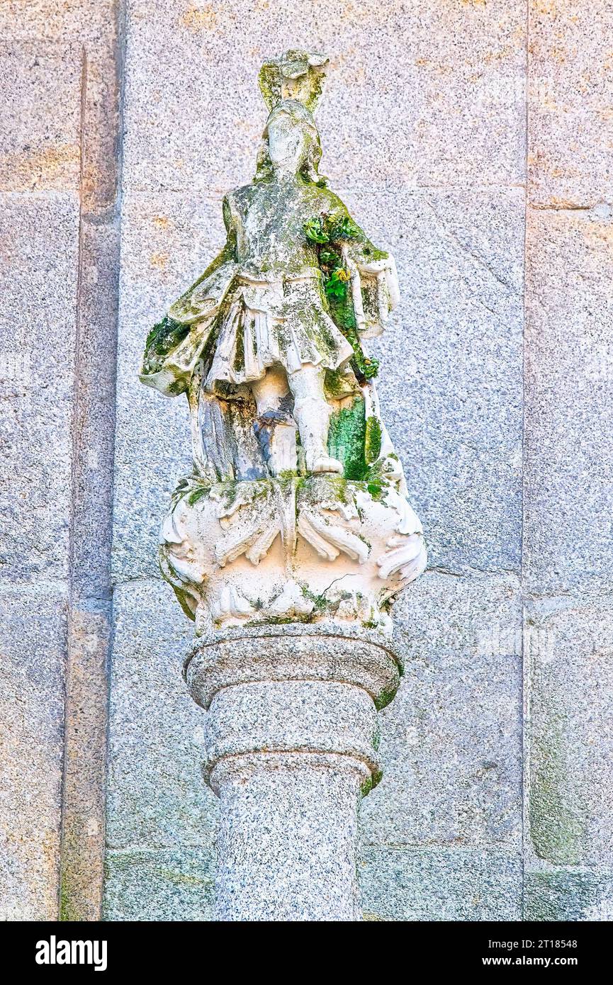 Medieval statue or stone sculpture in the Fountain of Sao Miguel or ...