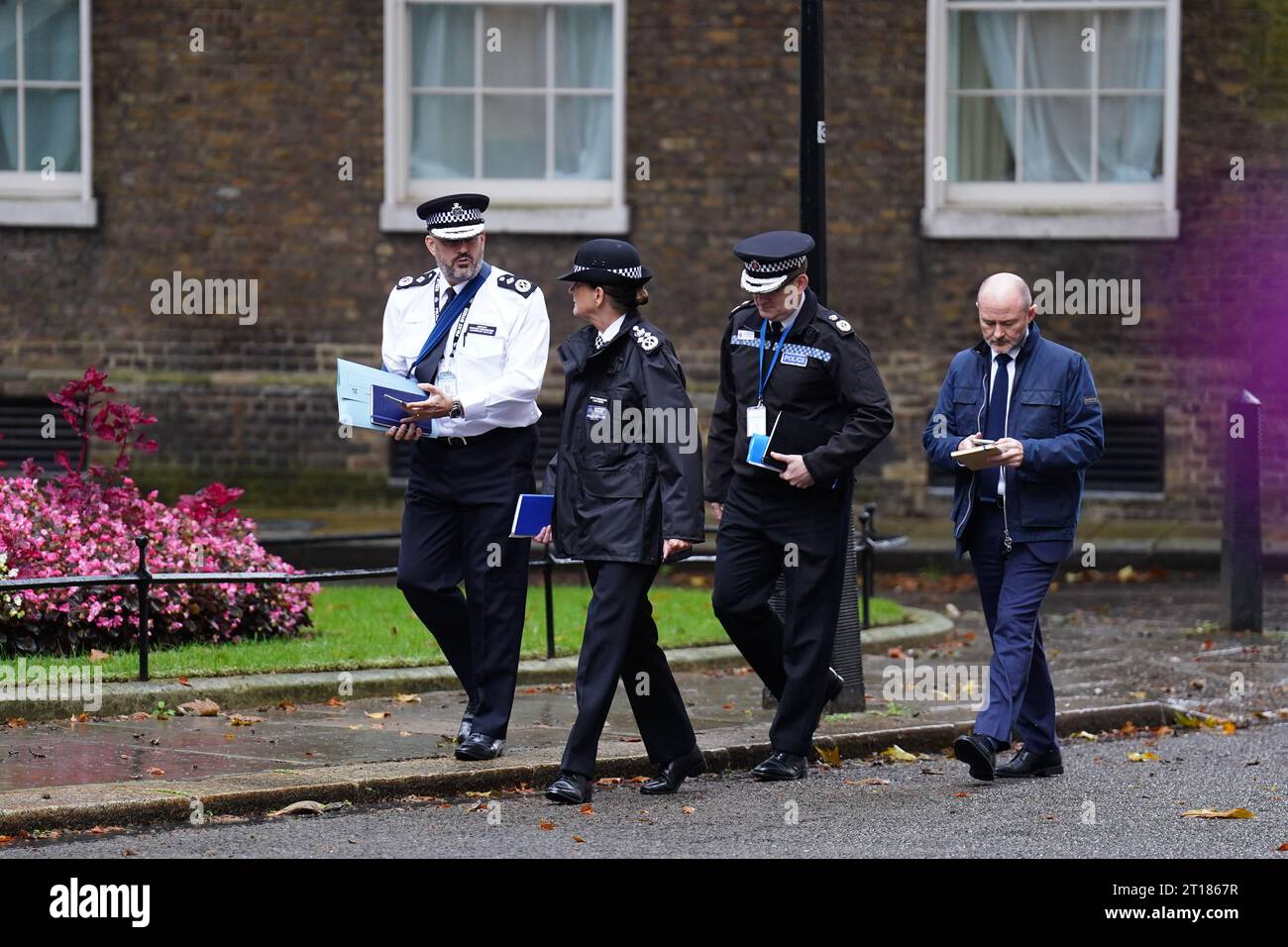Police officers arrive in Downing Street, London for a roundtable ...