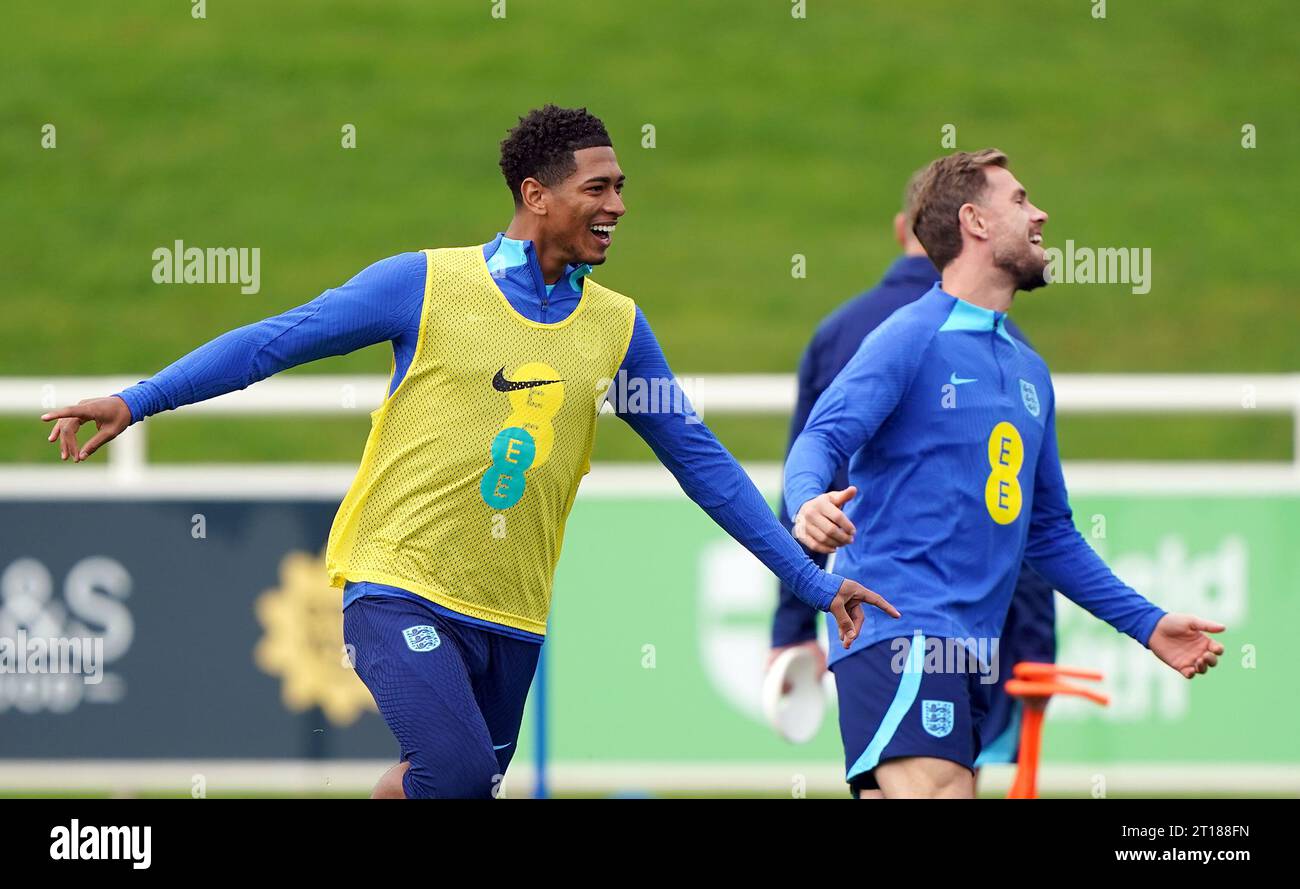 England's Jude Bellingham and Jordan Henderson during a training ...