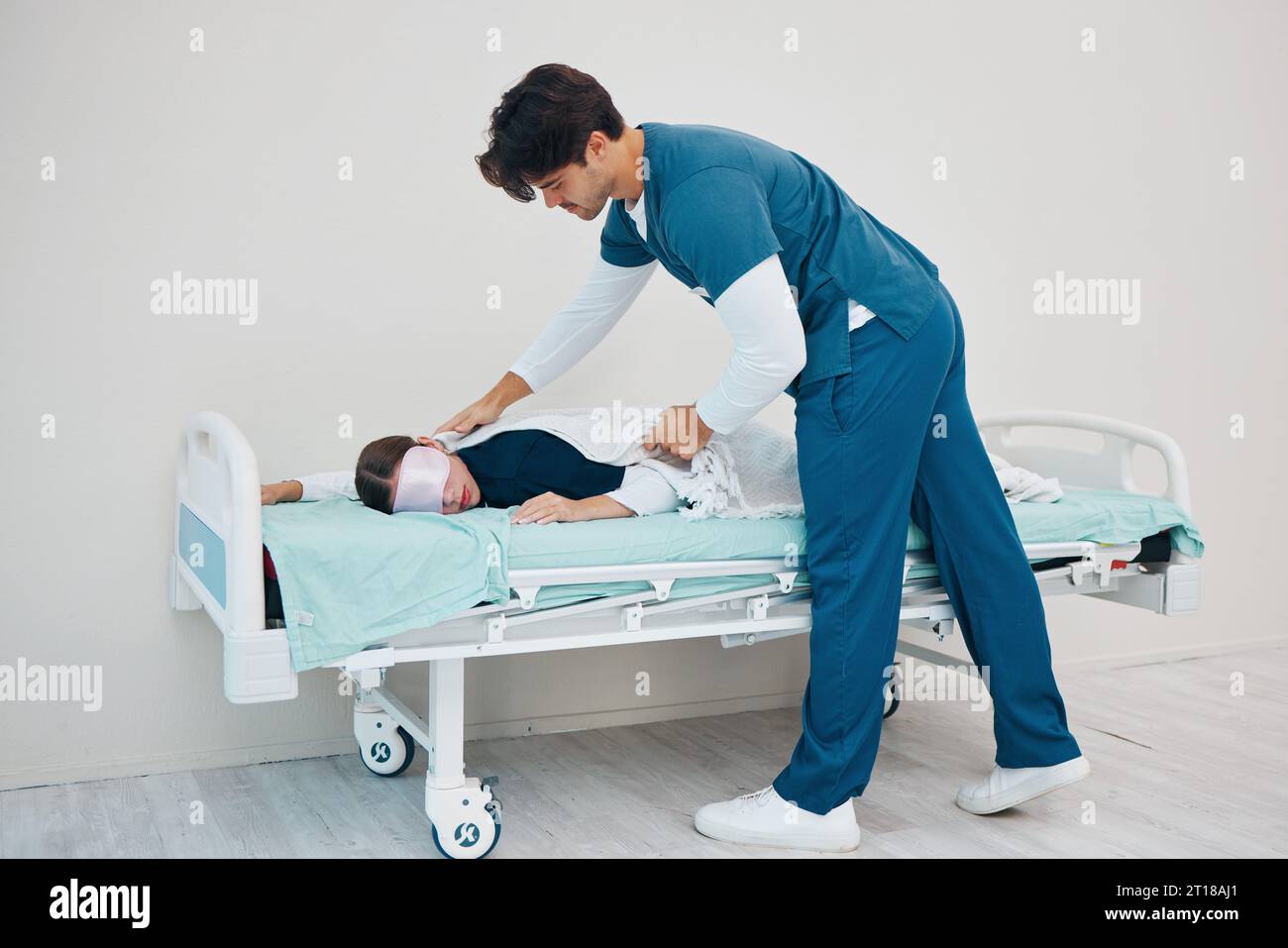 Sleeping, hospital and tired nurse on bed for rest, nap and break for ...