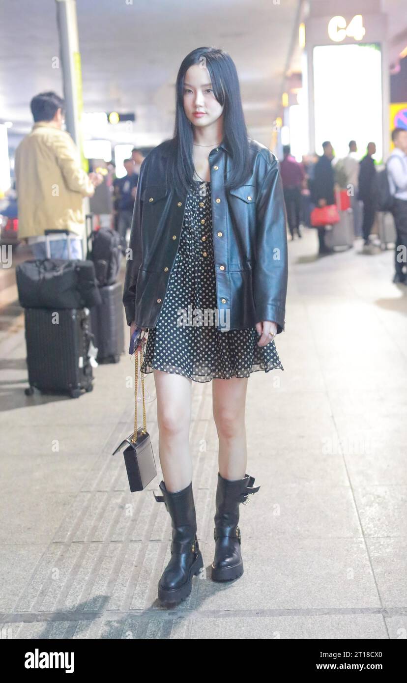 Chinese singer Huang Ling appears at the airport in Changsha City ...
