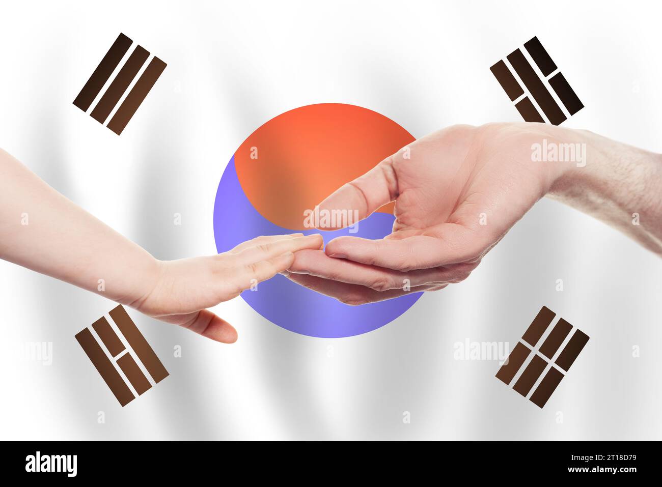 Korean baby and parent hands on the background of flag of Korea Help ...
