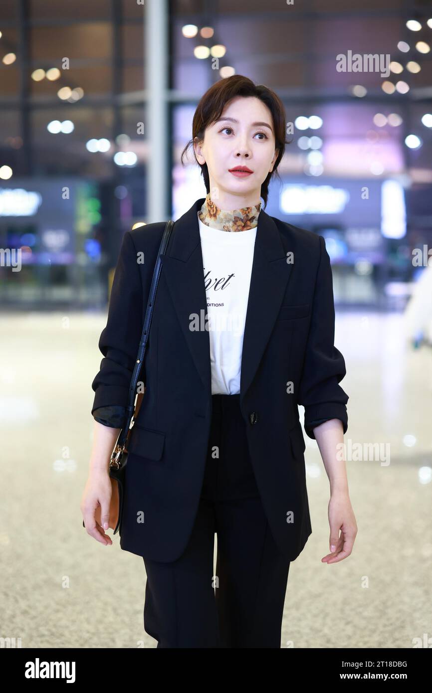 Chinese singer and actress Chen Shu appears at the airport in Shanghai ...
