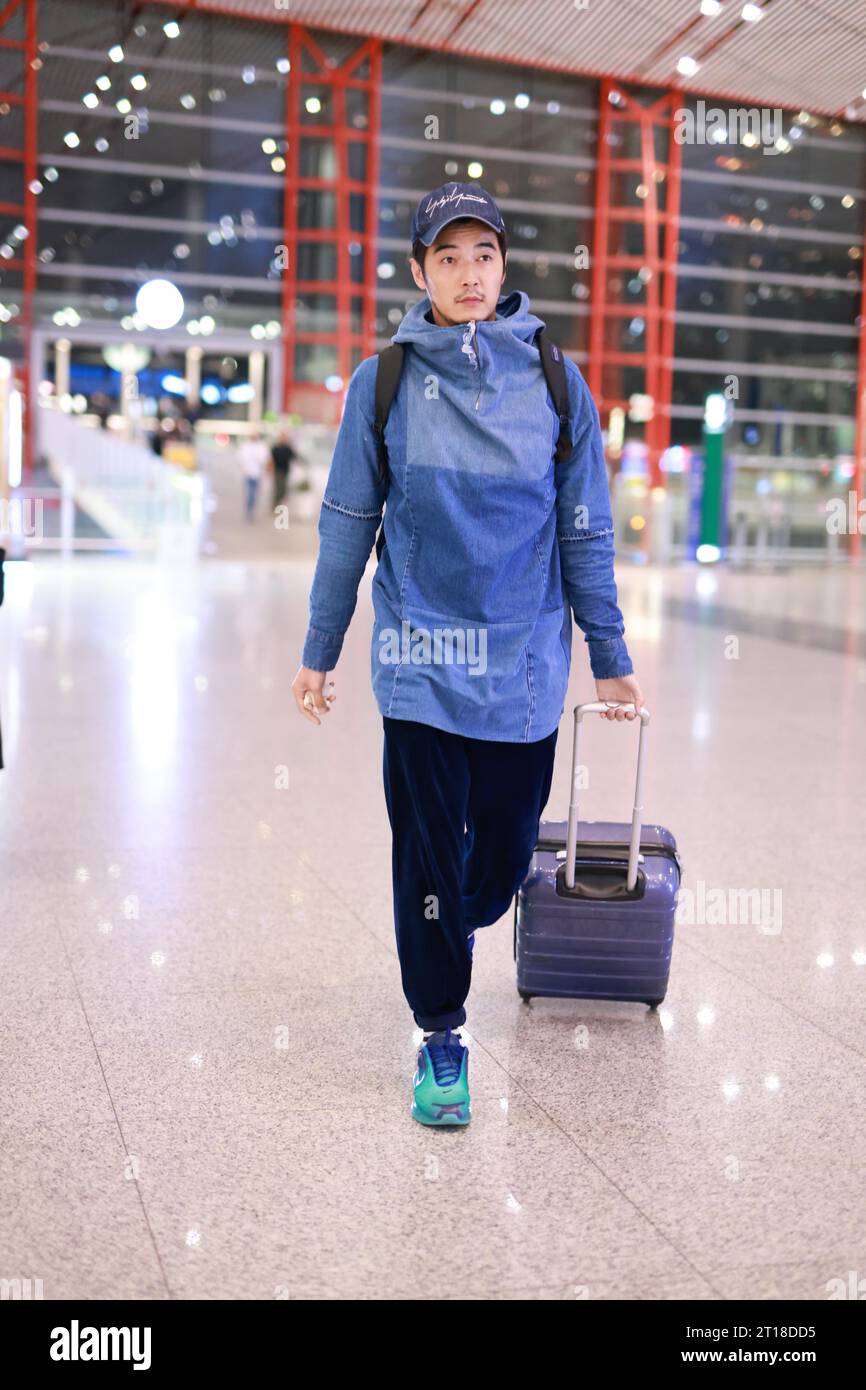 Chinese actor and swimmer Jin Shijia appears at the airport in Beijing ...