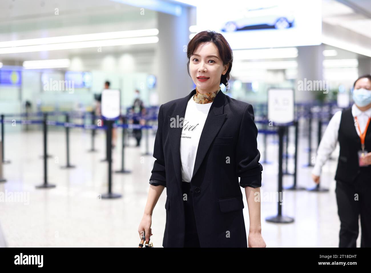 Chinese singer and actress Chen Shu appears at the airport in Shanghai ...