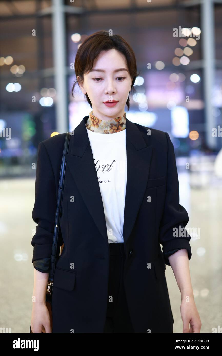 Chinese singer and actress Chen Shu appears at the airport in Shanghai ...