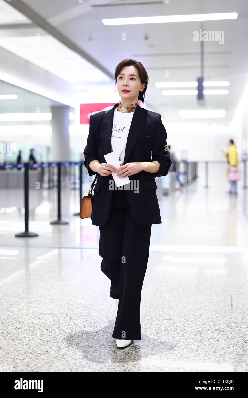 Chinese singer and actress Chen Shu appears at the airport in Shanghai ...