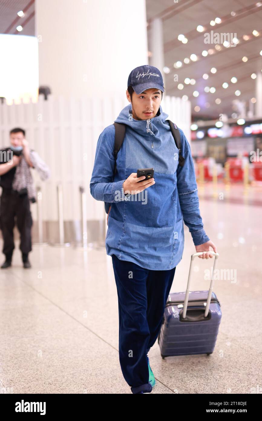 Chinese actor and swimmer Jin Shijia appears at the airport in Beijing ...