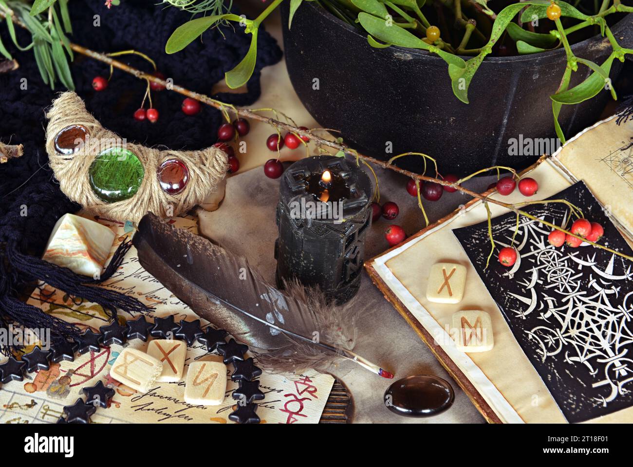 Tarot cards, runes and magic book of spell on witch table. Occult ...