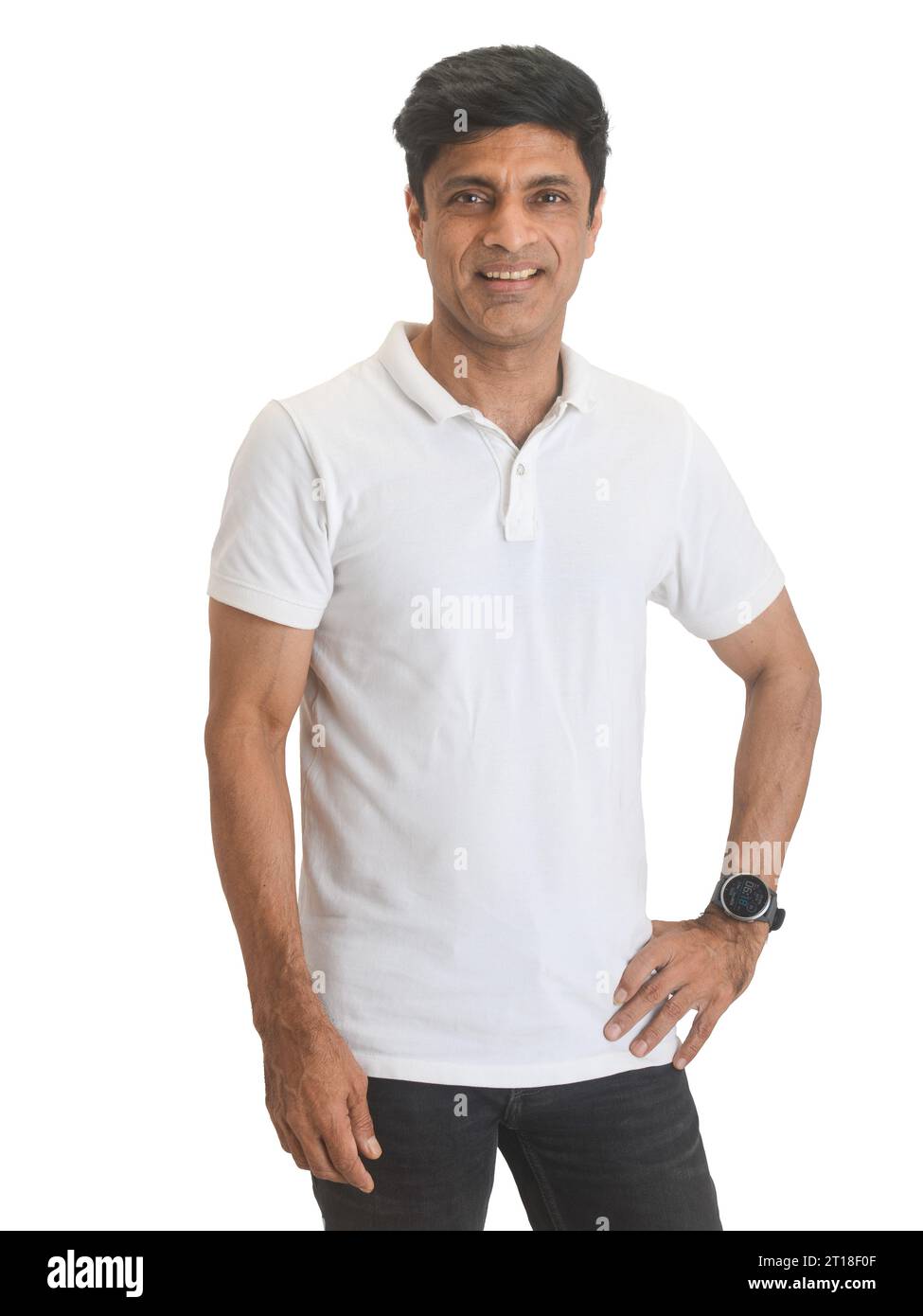 A smart middle-aged fit Indian man in a white t-shirt - studio shot ...