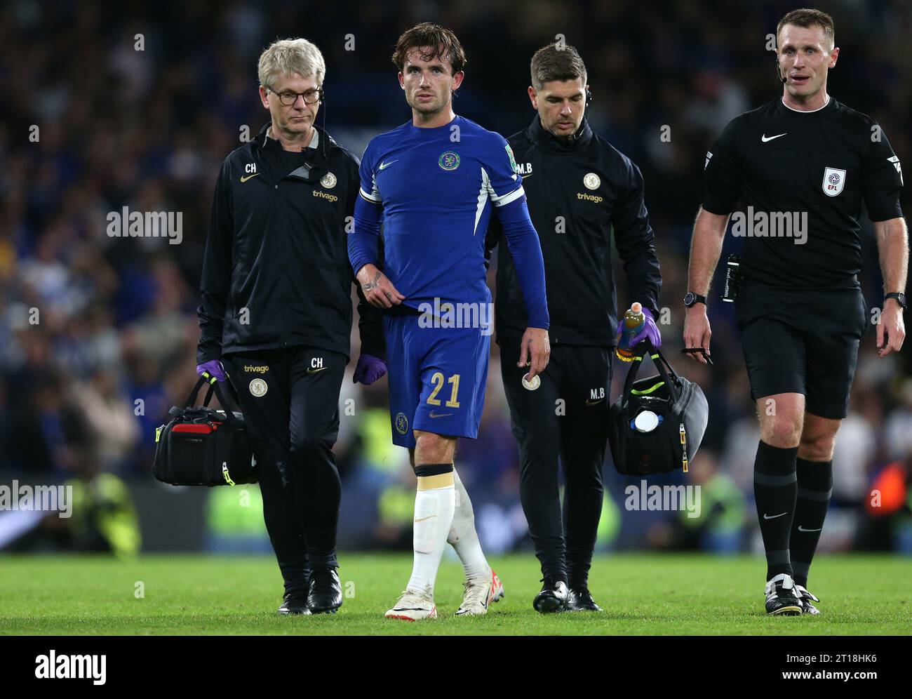 Ben Chilwell of Chelsea is taken off the pitch by medical staff after a ...