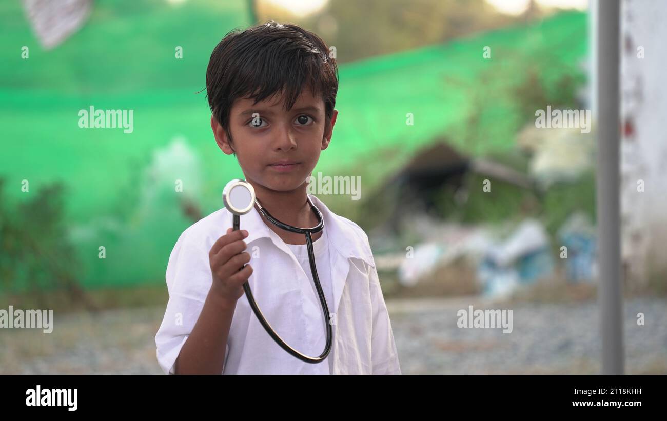 Kid doctor or pediatrician with stethoscope listening to heartbeat boy ...