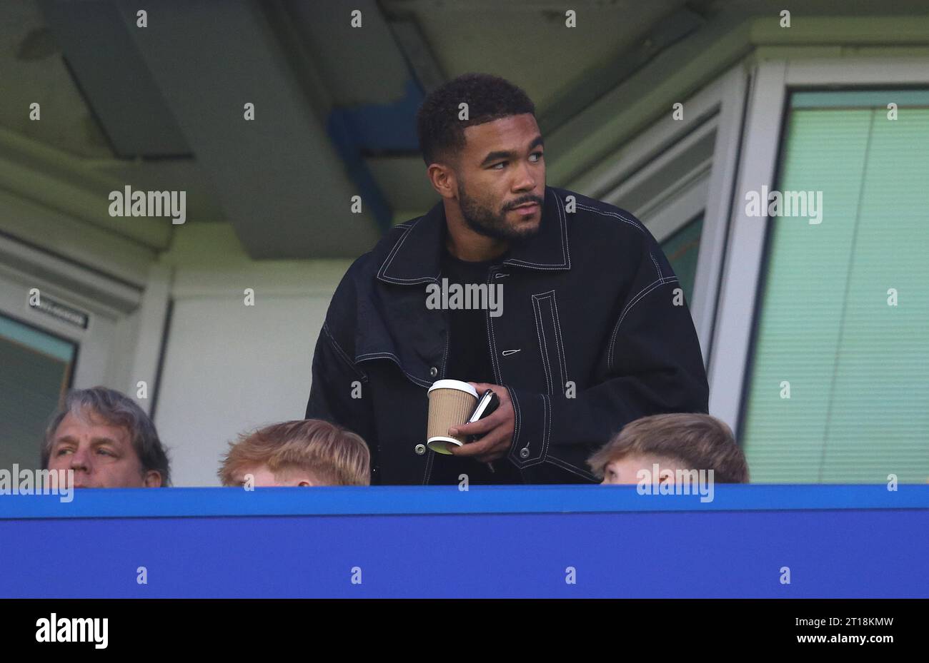 Reece James of Chelsea watches on from Chelsea Owner Todd Boehly ...