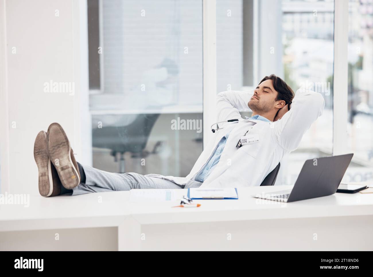 Man, doctor and sleeping in relax for done, completion or finished at ...