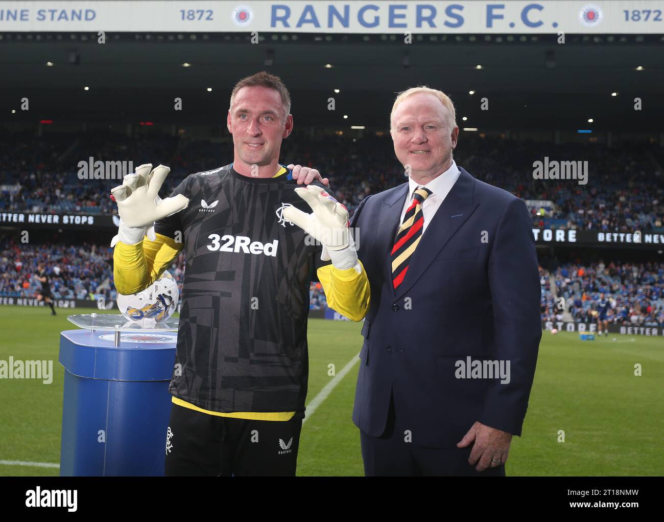 Alex McGregor of Rangers receives a commemorative bottle of wine from ...