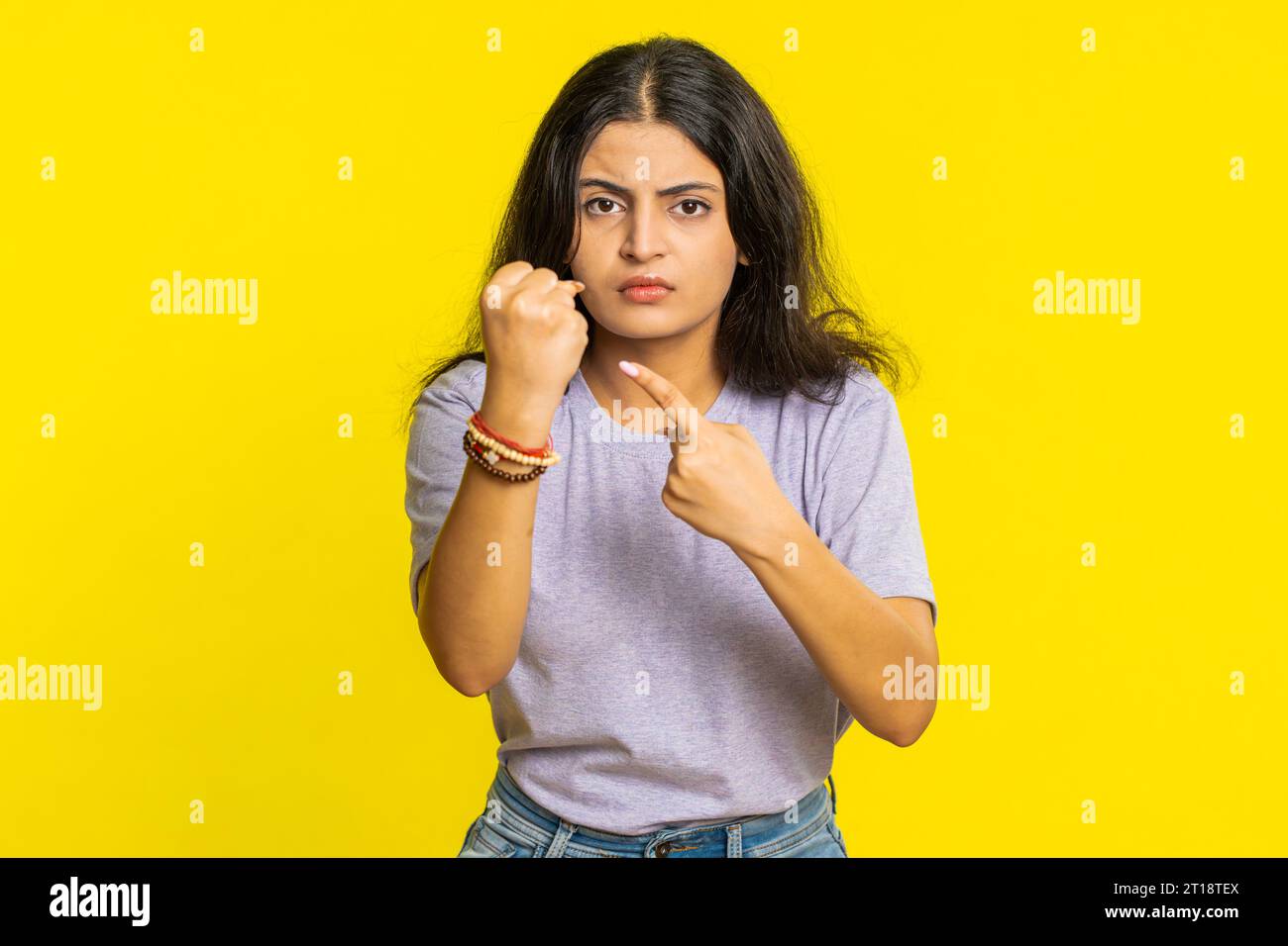Aggressive angry Indian young woman trying to fight at camera, shaking ...