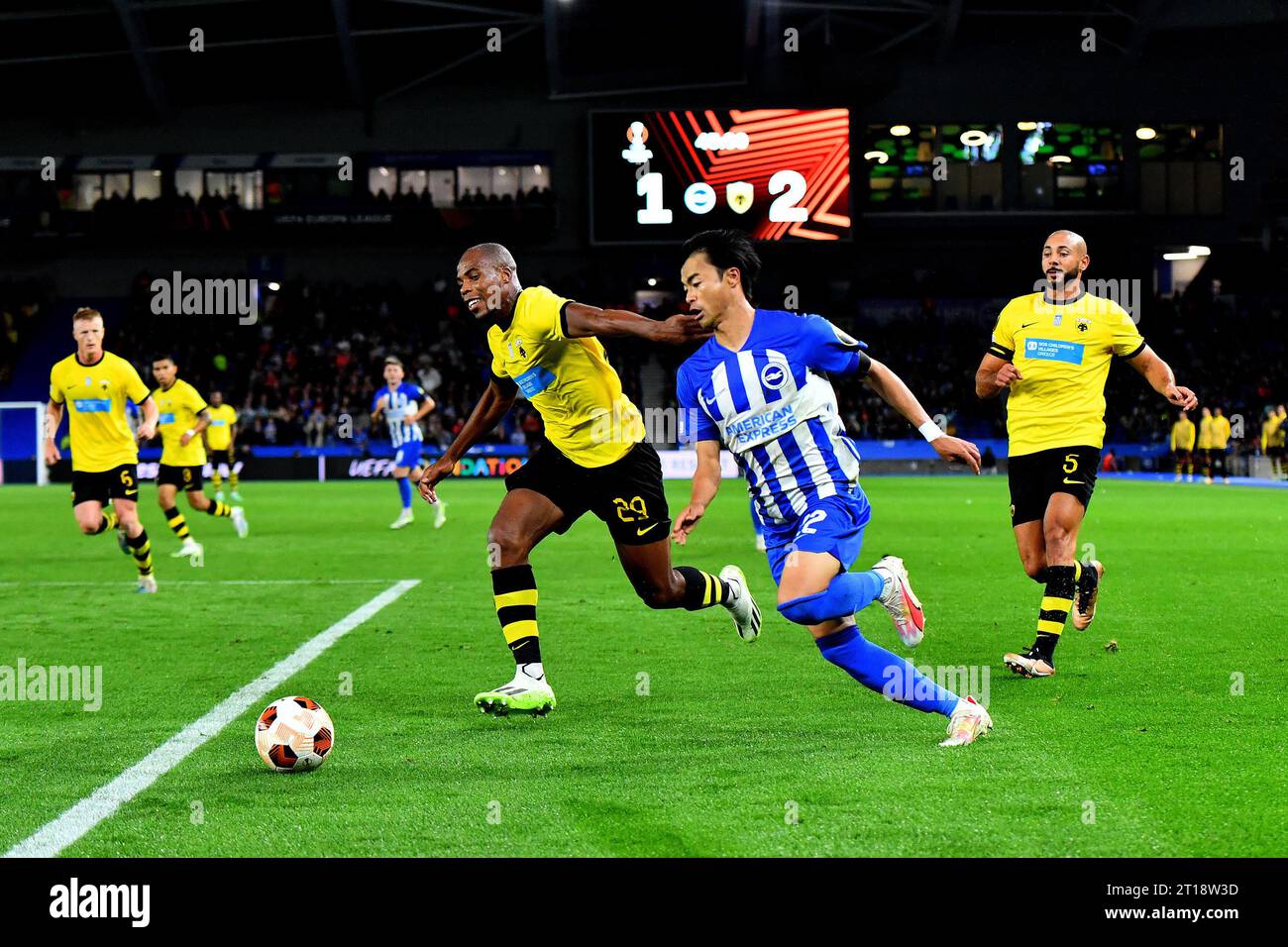 Djibril Sidibe of AEK Athens Kaoru Mitoma of Brighton and Hove Albion ...