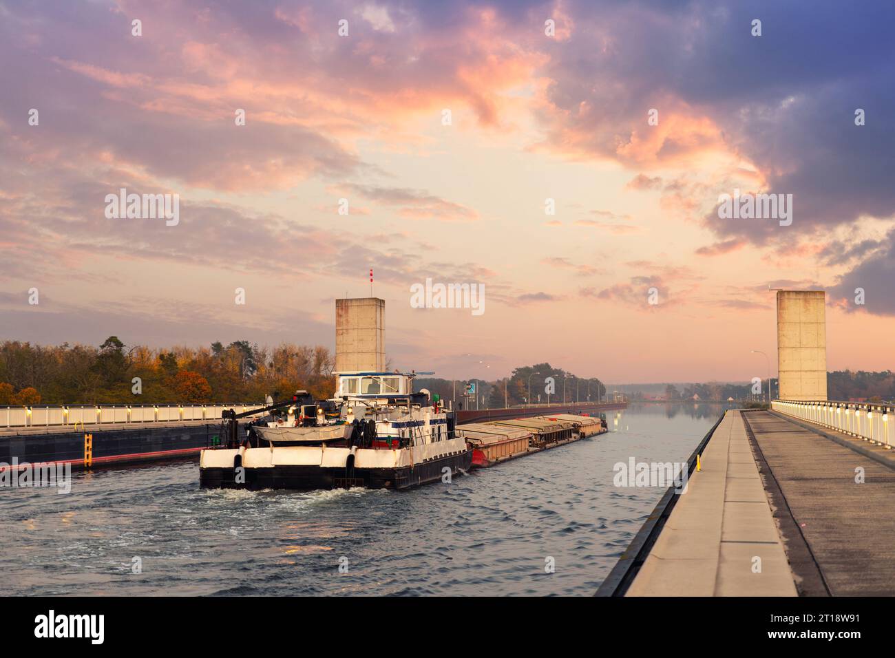 Scenic view od big cargo freight tugboat barge boat ship sailing by ...
